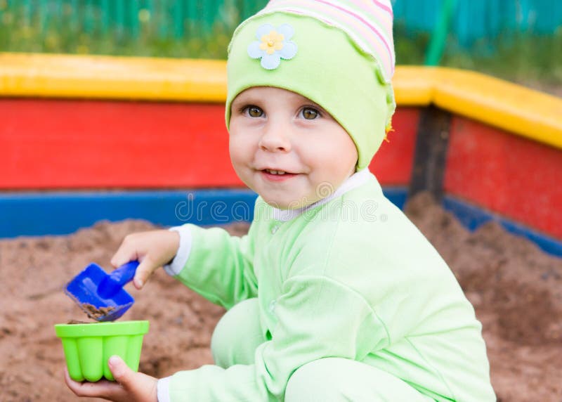 Little Kid Playing in a Sandbox Stock Photo - Image of playful, baby ...