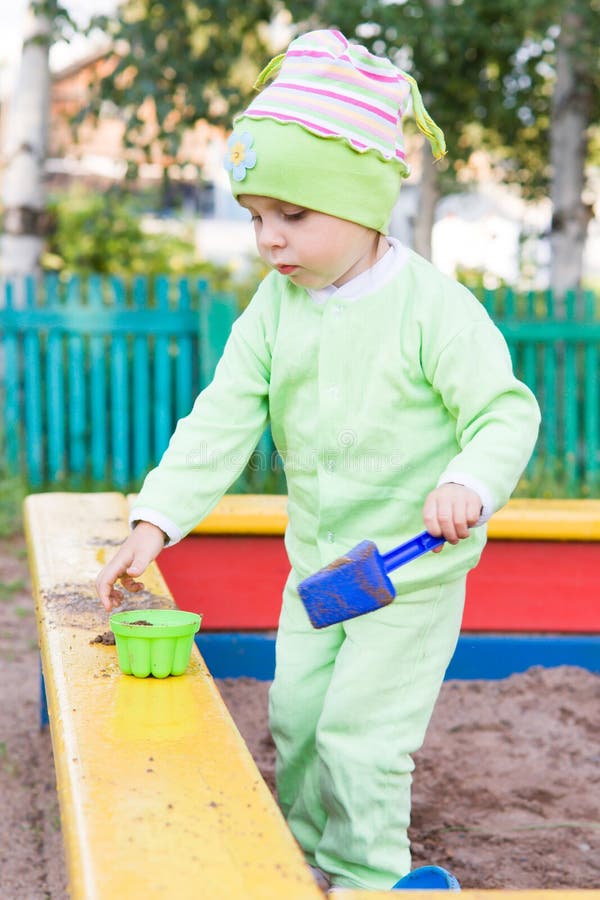 Little Kid Playing in a Sandbox Stock Image - Image of people ...