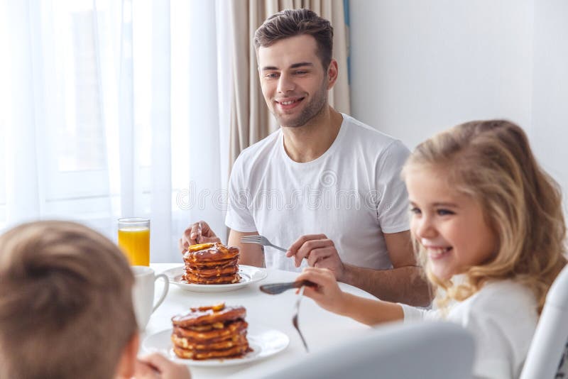 Little Kids Having Breakfast with Father Stock Photo - Image of people ...
