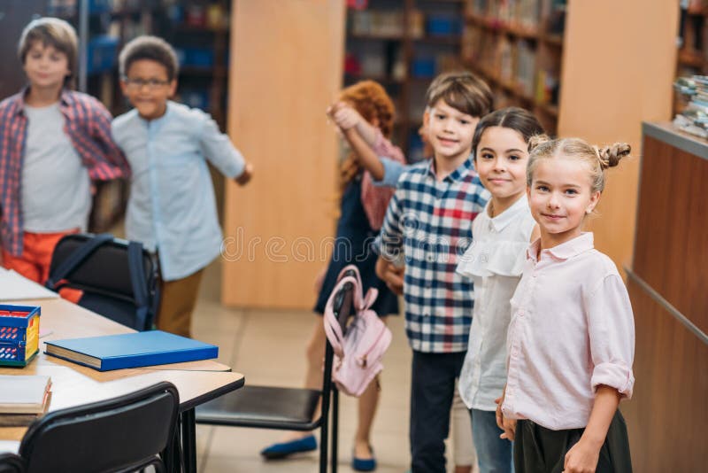 Little kids in library stock image. Image of kids, library - 129469931