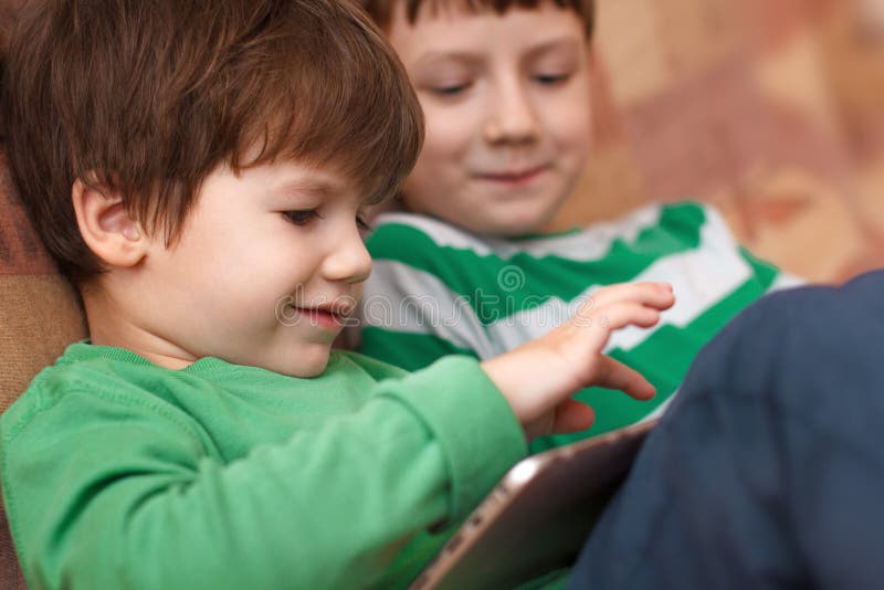 Child with Tablet Computer Sitting Outdoors. Education, Learning ...
