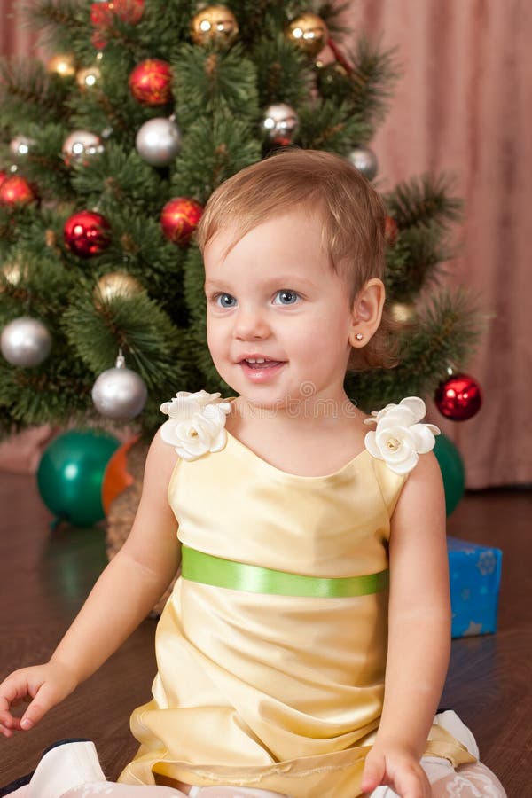 Little Lady in Gold at the Christmas Tree Stock Image - Image of ...