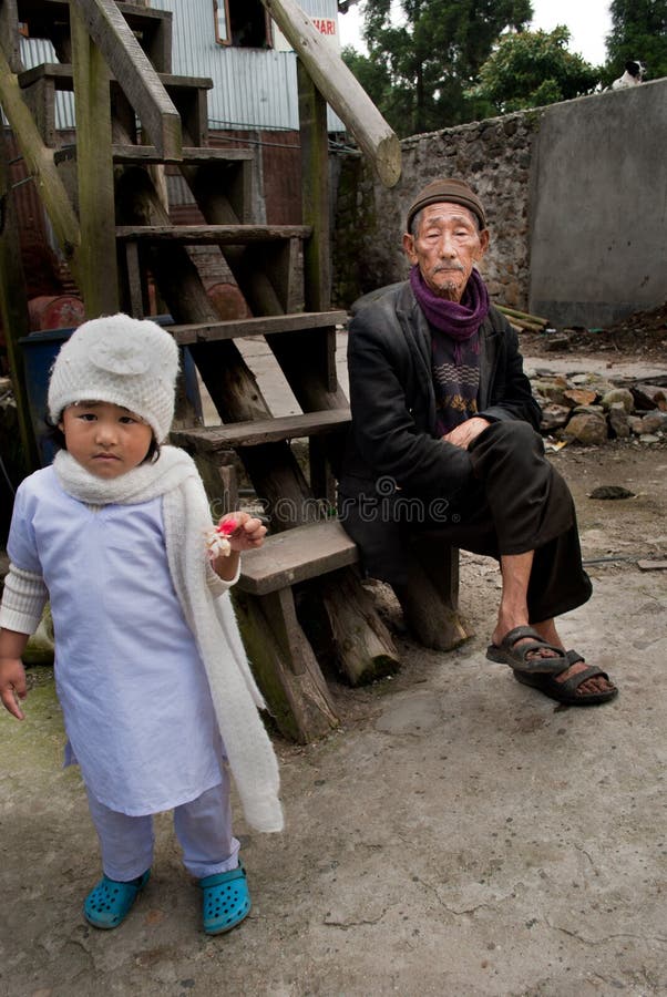 A Little Lepcha Boy and Hen Family Editorial Stock Image - Image of ...