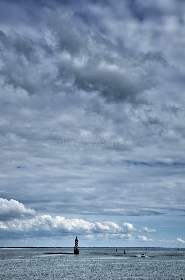 Little Lighthouse with Cloudy Sky on Background Stock Photo - Image of ...