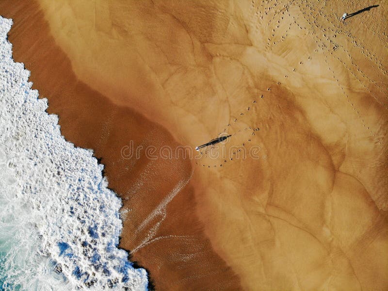 Little Man on the Beach with Waves Aerial Drone View. View from Top ...
