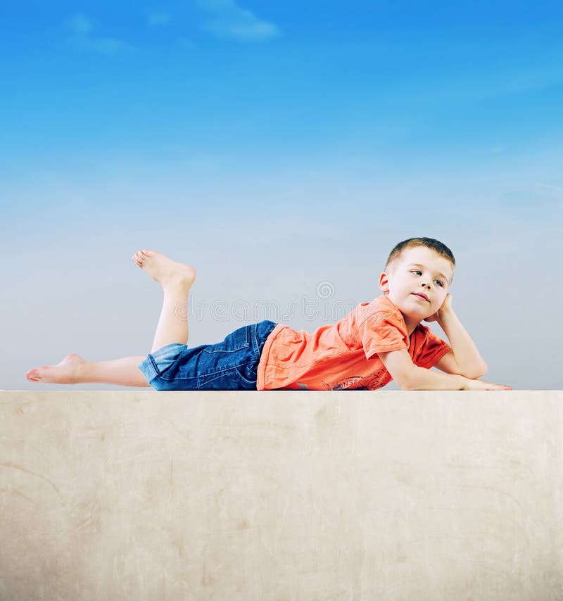 Little Man Relaxing after Tiring Play Stock Photo - Image of jeans ...