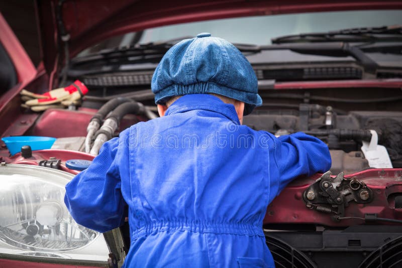 Child Mechanic Working In Workshop Stock Image - Image of worker ...