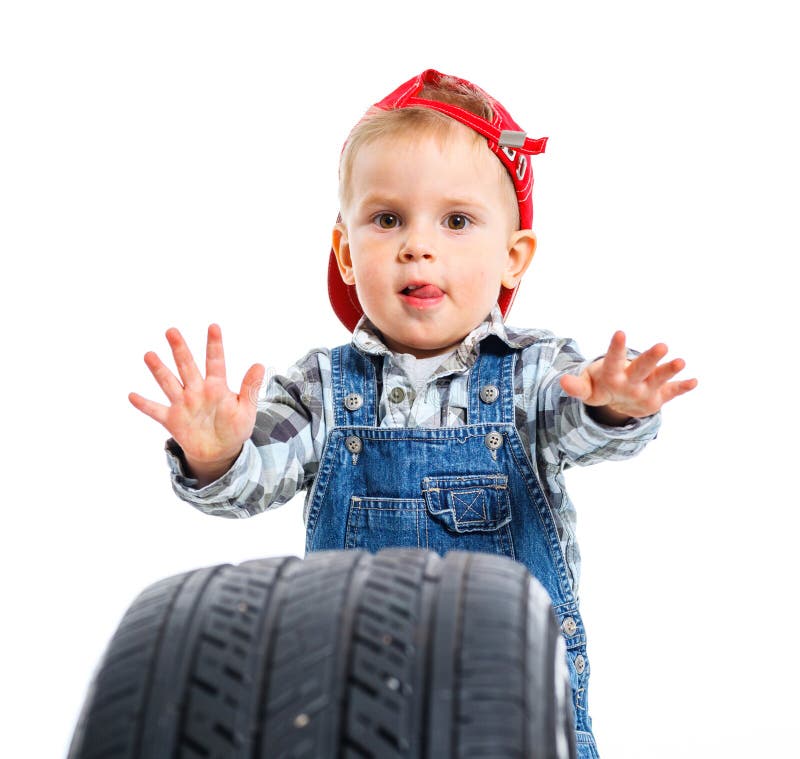 Little Mechanic with a Tire Stock Photo - Image of shirt, mechanic ...