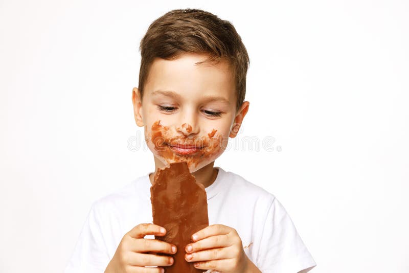 Little Messy Boy is Eating Chocolate Studio Shot Stock Photo - Image of ...