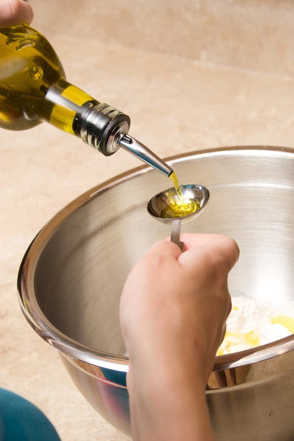 Olive oil in measuring cup stock photo. Image of olive - 62567162