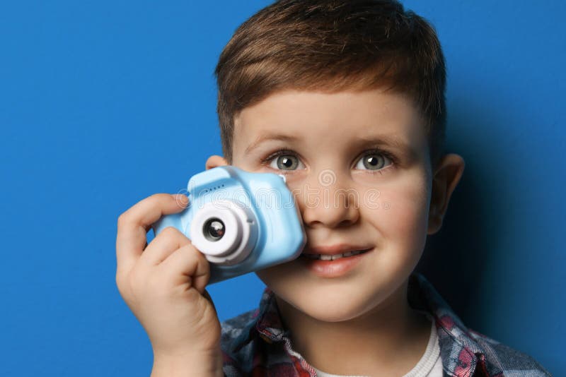 Little Photographer with Toy Camera on Background Stock Photo - Image ...