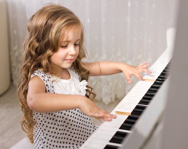 Little piano player stock image. Image of blond, clothes - 26046697
