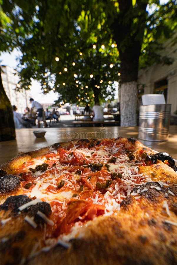 Little Pizza on a Table in a Street Cafe Stock Photo - Image of table ...