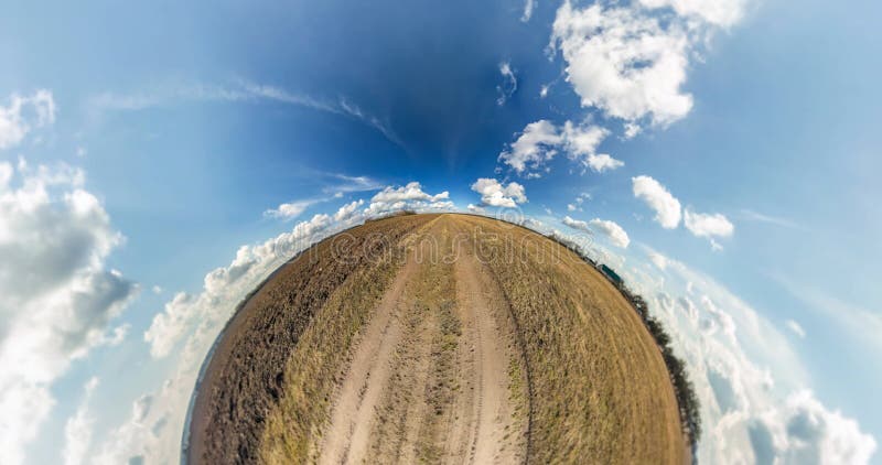 Little Planet Rotates in Beautiful Blue Sky with Rain Clouds. Tiny ...
