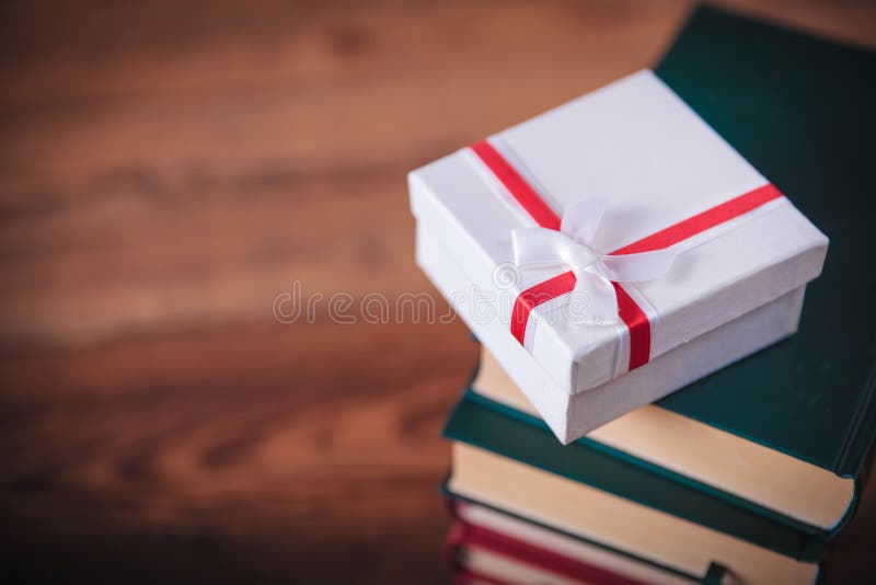 Little Present Box on Top of Books Stock Image - Image of bunch, copy ...