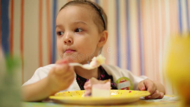 A Pretty Girl with a Sweet Smile is Holding a Modern Mobile Phone ...