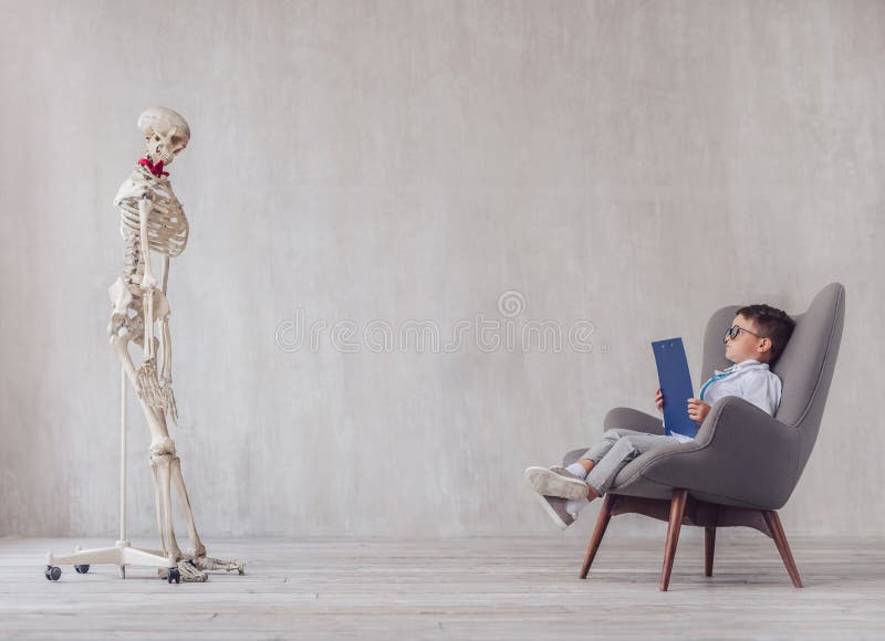 Little Professional and a Skeleton Stock Image - Image of play, chair ...