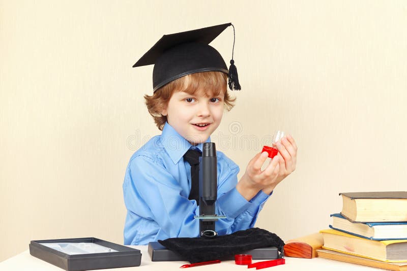 Little Professor in Academic Hat with the Jars for Research Next To ...