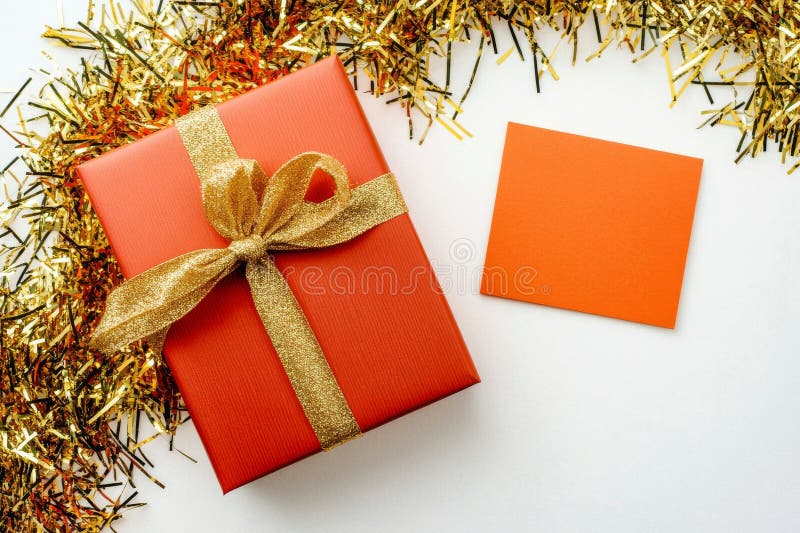 A Little Red Box, Highlighted with a Golden Ribbon, is Placed on a ...