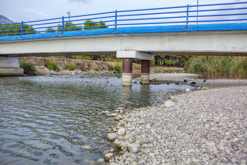 Little river and bridge stock image. Image of green - 147722469