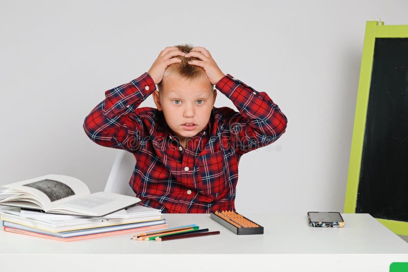 167 Frustrated Little Boy Doing Homework Stock Photos - Free & Royalty ...