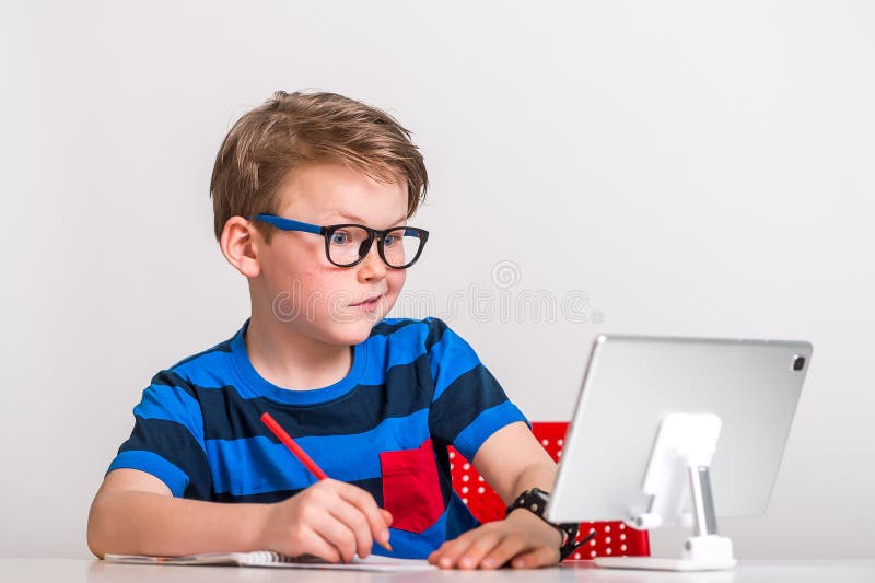 Little School Kid with Glasses Making Homework on Computer. Child ...