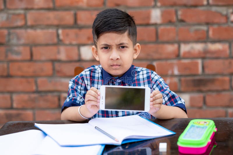 Little School Kid Learning from Mobile , he is Showing His Mobile Phone ...