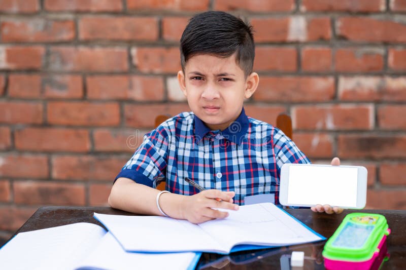 Little School Kid Learning from Mobile , he is Showing His Mobile Phone ...