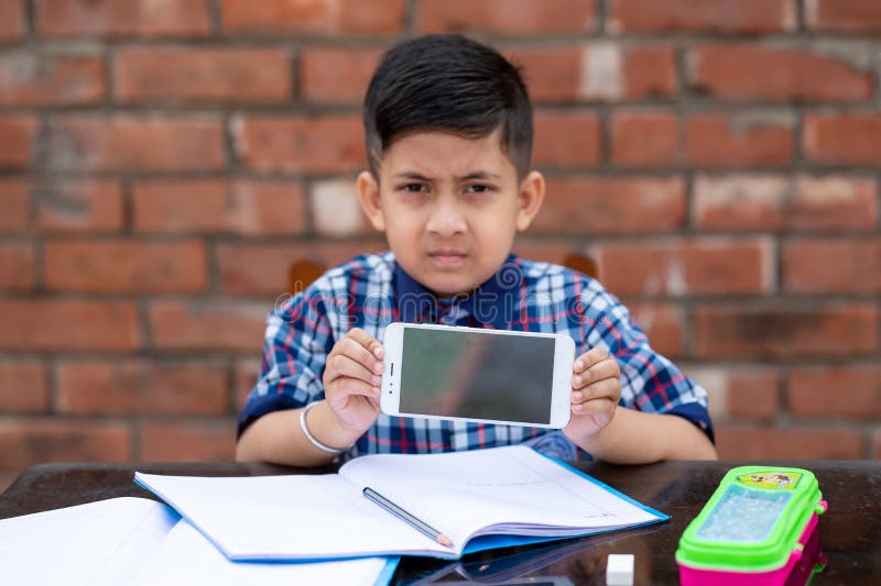 Little School Kid Learning from Mobile , he is Showing His Mobile Phone ...