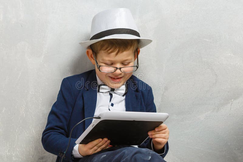 Little Schoolboy Having Fun with His Tablet Stock Image - Image of ...