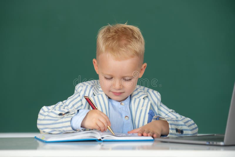 Kid Writing in Class. School Child Student Learning in Class, Study ...