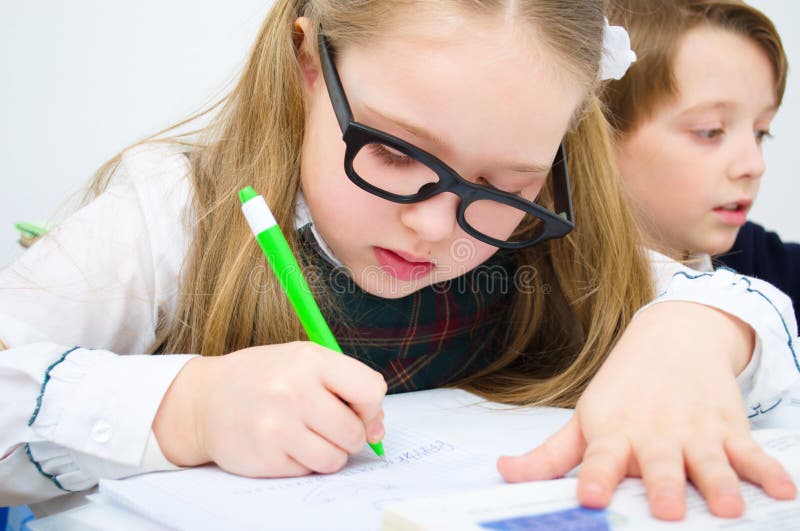 Little Schoolchildren Writing in Workbook Stock Photo - Image of pencil ...