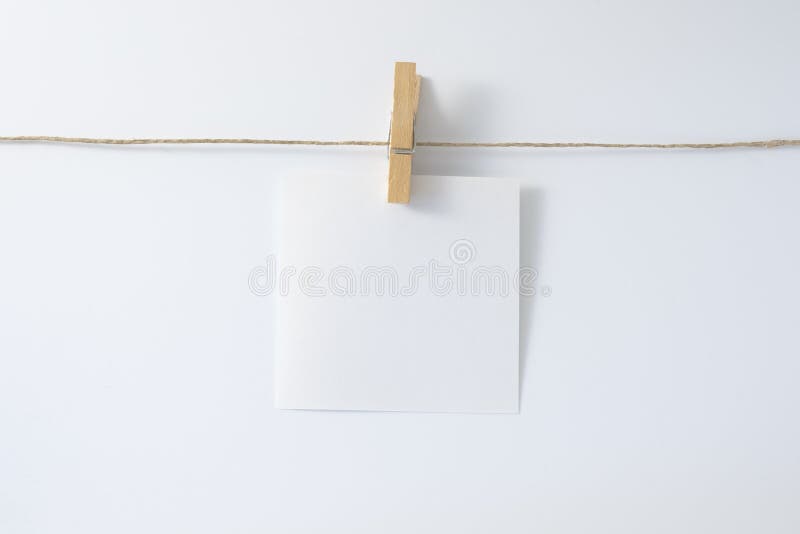 A Little Sheet of Paper Hold by a Clipboard on a String. Stock Photo ...