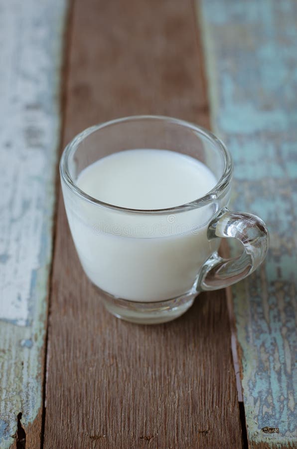 Little Short Glass of Milk. Stock Image - Image of break, wood: 189875583