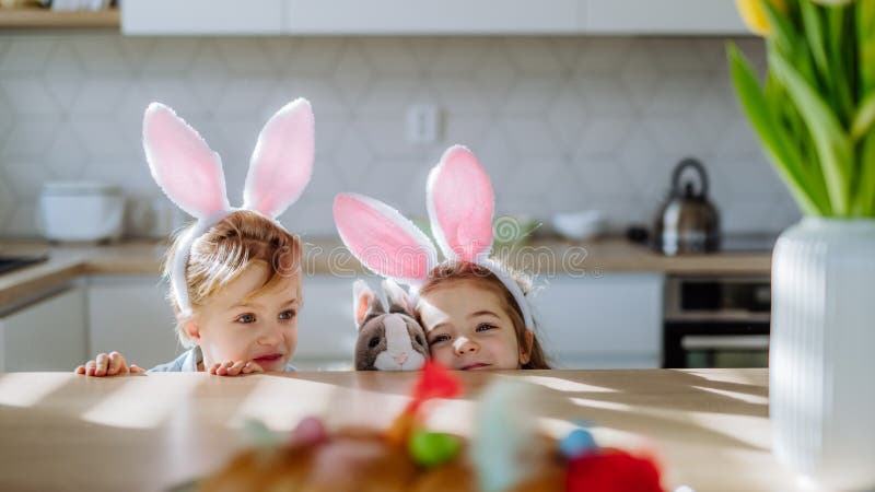 Little Siblings Enjoying Easter Time Together in Home. Stock Photo ...