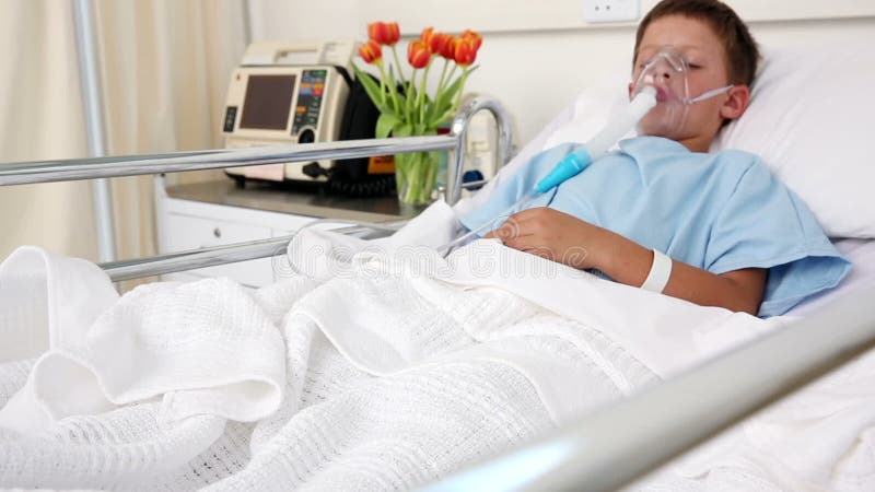 Little Sick Boy Sleeping in Bed with Needle in Foreground Stock Footage ...