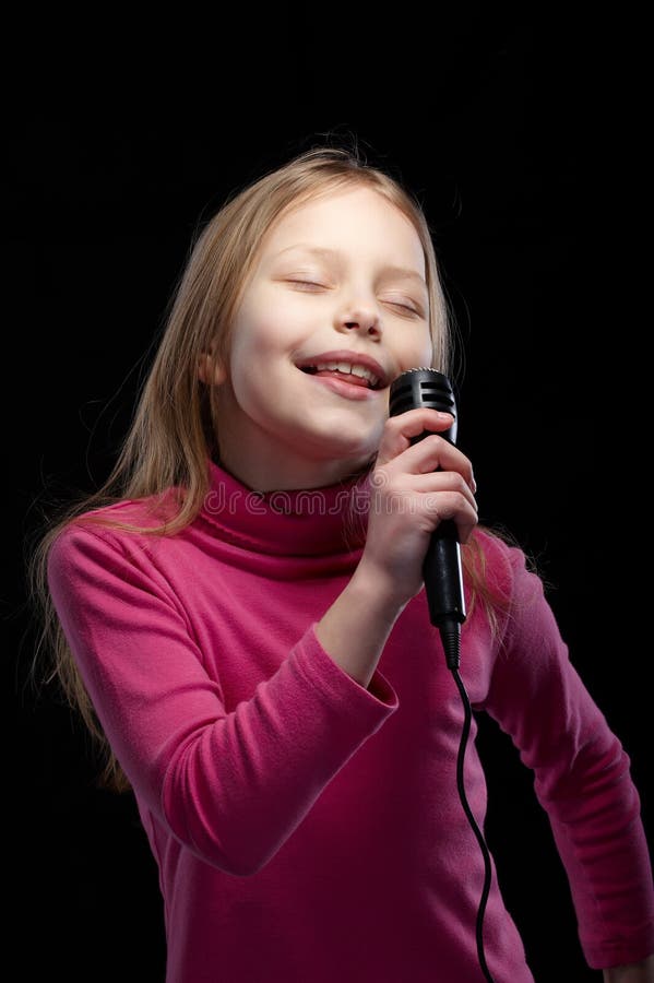 Adorable Child Singing into Microphone Stock Image - Image of activity ...