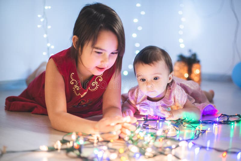 Little Sisters Having Fun at Home with Chrismas Lights Stock Image ...