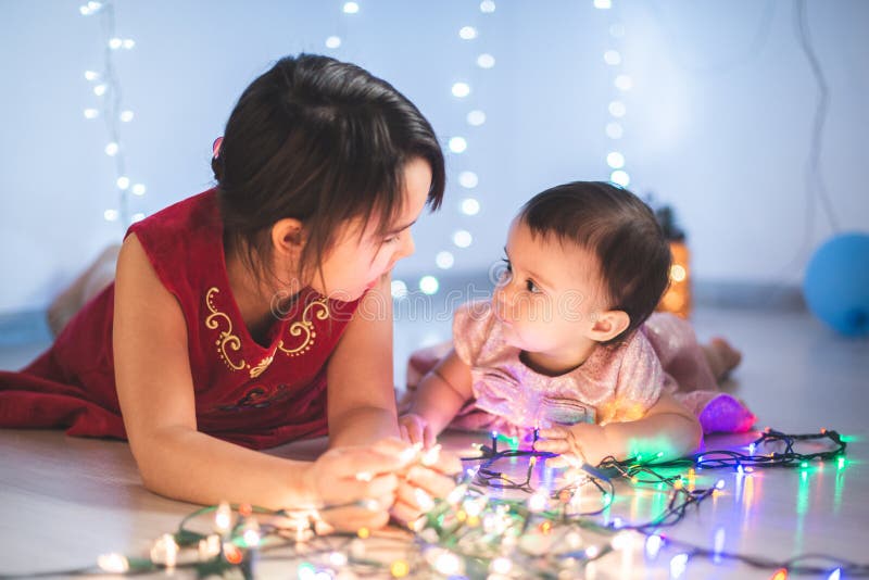 Little Sisters Having Fun at Home with Chrismas Lights Stock Image ...
