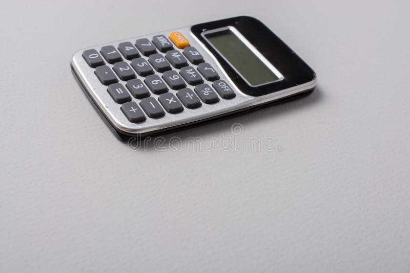 Little Calculator in Hand with Colorful Letters Behind Stock Image ...