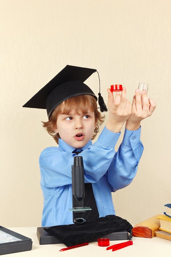 Little Smart Boy in Academic Hat Conducts Research with Microscope ...