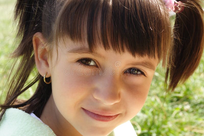 Little Girl with Cheeky Smile Stock Photo - Image of childhood, delight ...