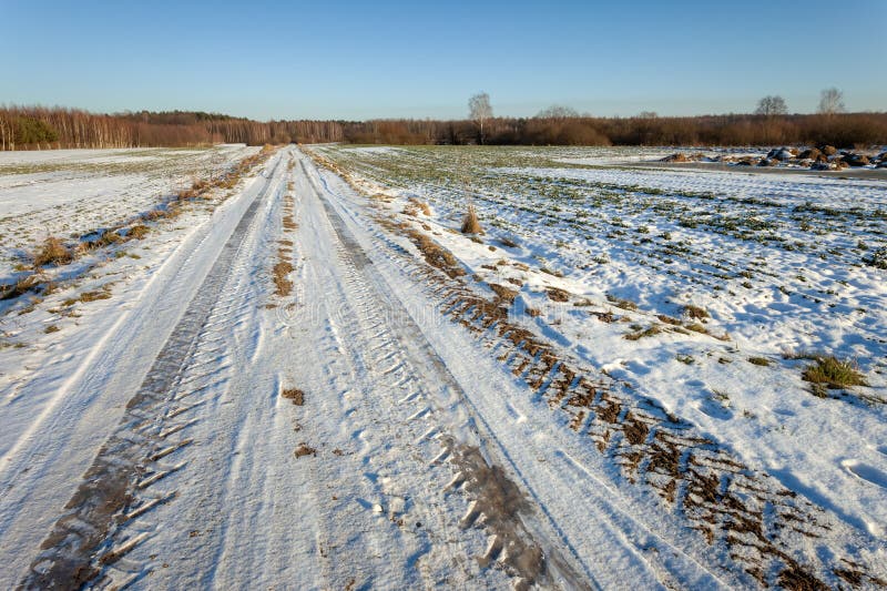 Little Snow and Ice on the Dirt Road through the Rural Fields Stock ...