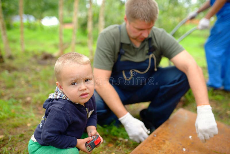 Little Son Helping His Father with Building Work Stock Photo - Image of ...