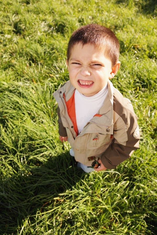 Baby boy squinting eyes stock image. Image of yucky, yuck - 18913015