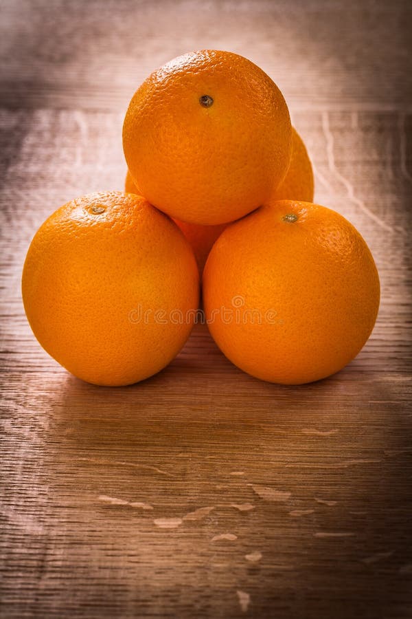 Little Stack of Orange Fruits on Wooden Desk Stock Photo - Image of ...