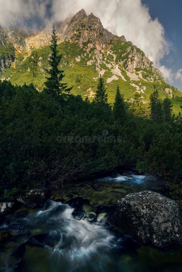 Stream and mountain stock image. Image of views, sunset - 141659421