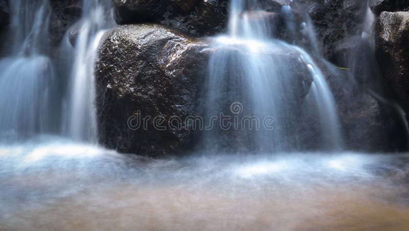 A Little Stream of Water Falling Gently Over Rocks or a Short Drop ...