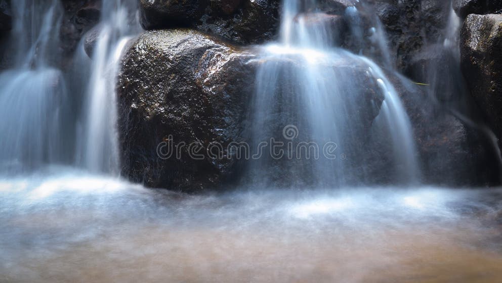 A Little Stream of Water Falling Gently Over Rocks or a Short Drop ...