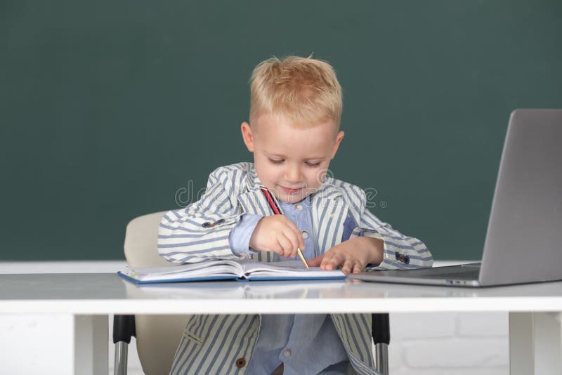 Little Student Child Studying in Classroom at Elementary School. Kid ...